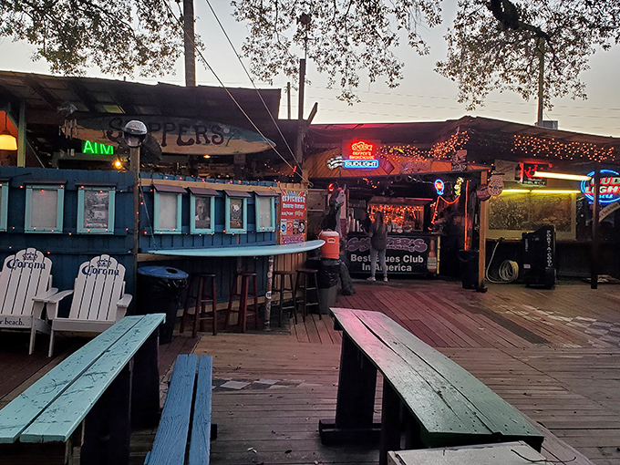 The weathered sign at Skipper's Smokehouse stands like a sentinel of good times, promising Florida flavors with a side of musical magic.