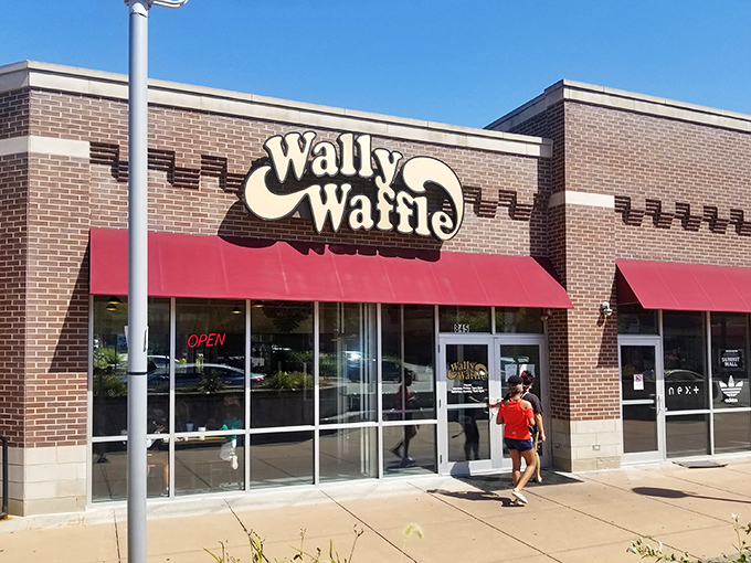 The brick exterior promises comfort food greatness, and those red awnings practically wave you in like old friends.