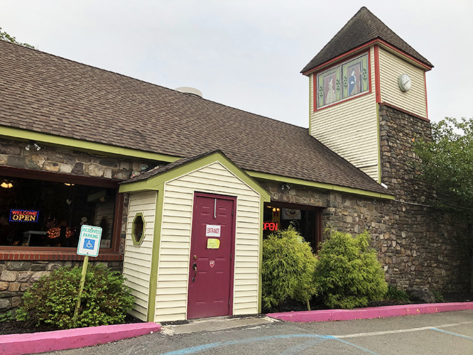 The stone-and-wood exterior of Hickory Valley Farm Restaurant stands like a rustic time capsule in Swiftwater, complete with that charming tower that practically winks at you.