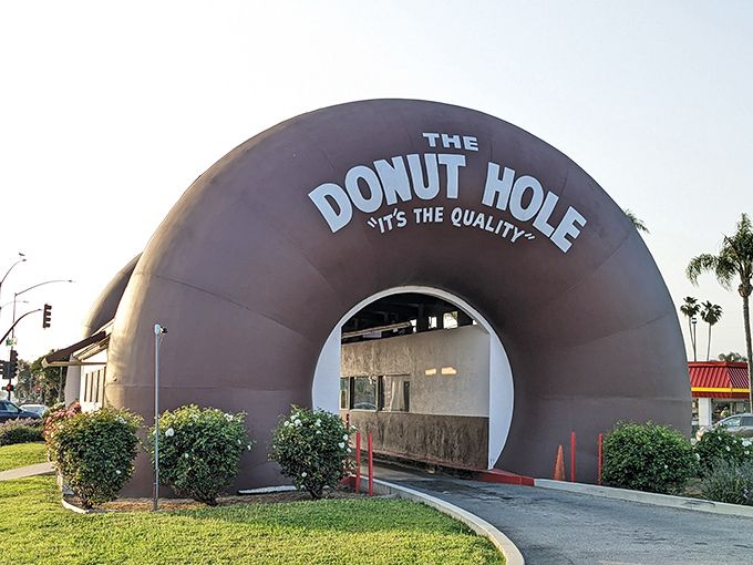 Architectural whimsy meets breakfast brilliance at The Donut Hole in La Puente, where your car literally drives through a giant donut. Only in California!