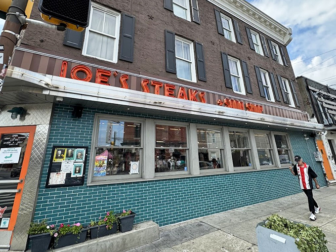 That iconic neon sign and turquoise tile exterior isn't just eye-catching&mdash;it's a time machine disguised as a corner shop in Philadelphia.