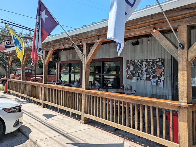 The Texas flag waves a hearty welcome outside Old 300 BBQ, where that wooden porch practically begs you to sit a spell after filling up on smoky goodness.