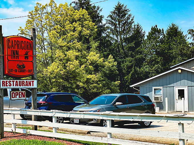 The unassuming blue exterior of Capricorn Inn stands like a culinary speakeasy, hiding delicious secrets behind its modest façade.