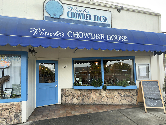 The iconic blue awning of Vivolo's stands out like a maritime flag, beckoning hungry travelers with the promise of chowder perfection.