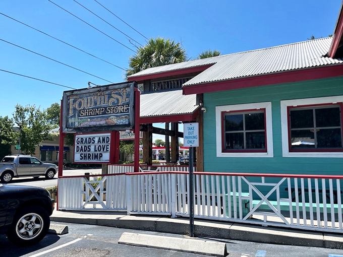 The aqua and red exterior of Fourth Street Shrimp Store stands as a beacon of seafood salvation on St. Petersburg's busy thoroughfare.