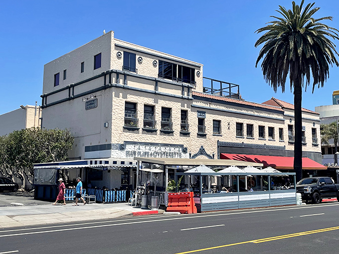 The blue and white striped awnings aren't just charming&mdash;they're practically waving "come eat something delicious" in maritime flag code.