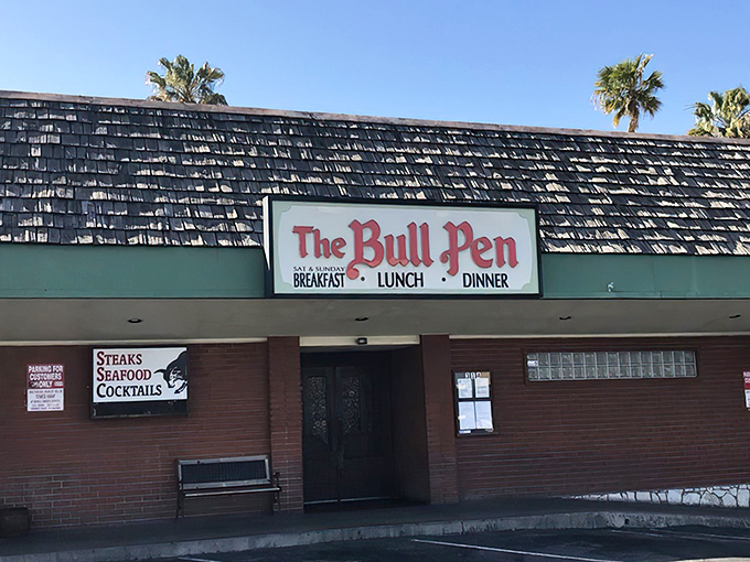 The unassuming exterior of The Bull Pen hides a culinary time capsule. Those weathered shingles have sheltered decades of memorable meals and celebrations.