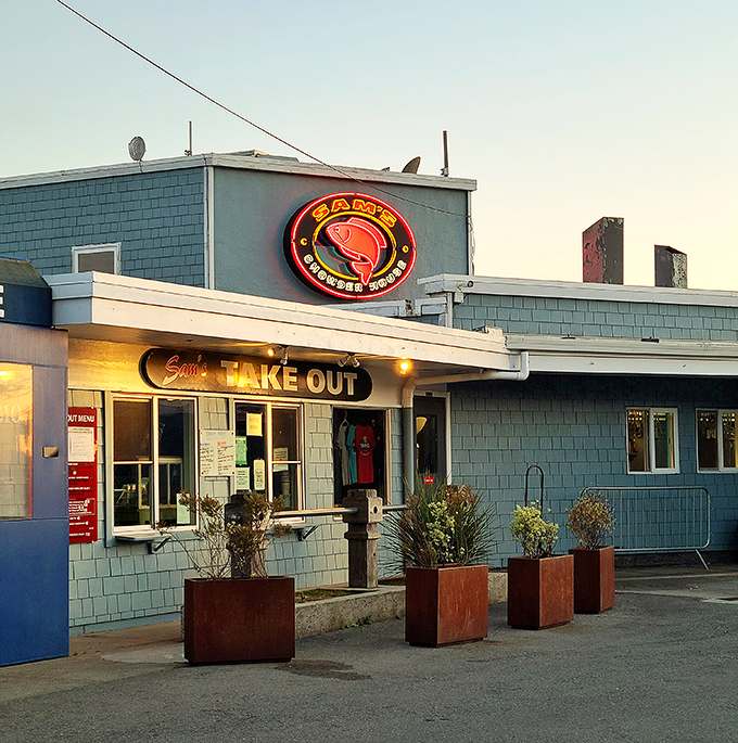 The iconic blue-shingled exterior with that glowing red crab sign&mdash;like a lighthouse guiding hungry seafood lovers home.