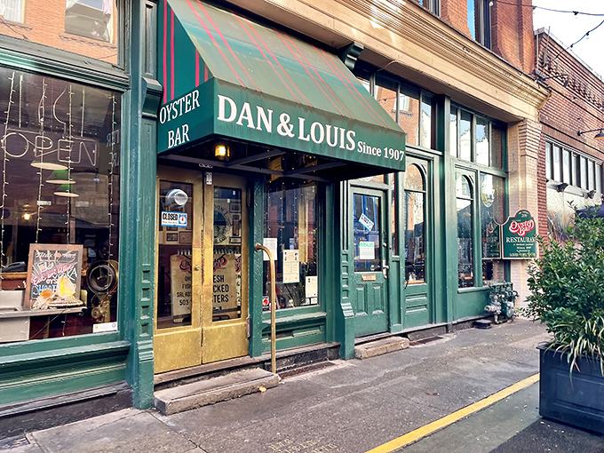 The iconic green awning and yellow doors of Dan & Louis Oyster Bar stand as a beacon for seafood lovers in downtown Portland. Maritime tradition meets urban charm.
