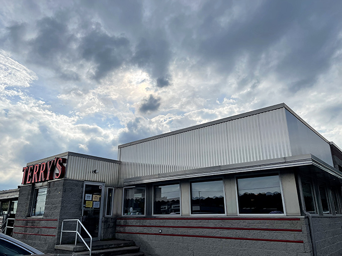 The classic stainless steel exterior of Terry's Diner gleams like a time machine to the golden age of roadside Americana. Those vintage soda machines aren't just for show!
