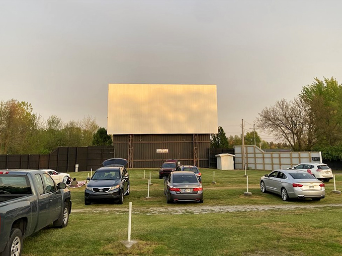 Cars lined up facing the massive white screen, where memories are made under Indiana skies. The perfect blend of nostalgia and modern movie magic.