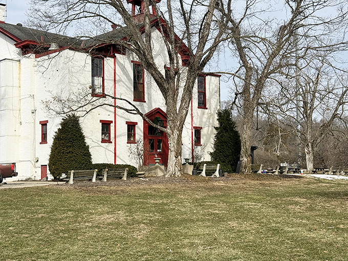 The historic white schoolhouse with its distinctive red trim stands as a culinary time capsule, promising comfort food that educates your taste buds.