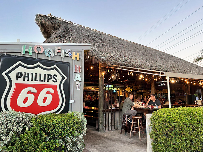 The thatched roof and Phillips 66 sign might make you think you've taken a wrong turn, but trust me&mdash;paradise awaits beneath that palm-thatched canopy.