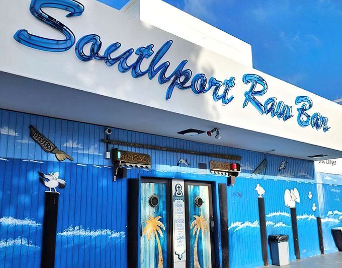The iconic blue "RAW BAR" sign beckons seafood lovers like a maritime lighthouse. This waterfront deck promises the kind of authentic Florida experience you can taste.