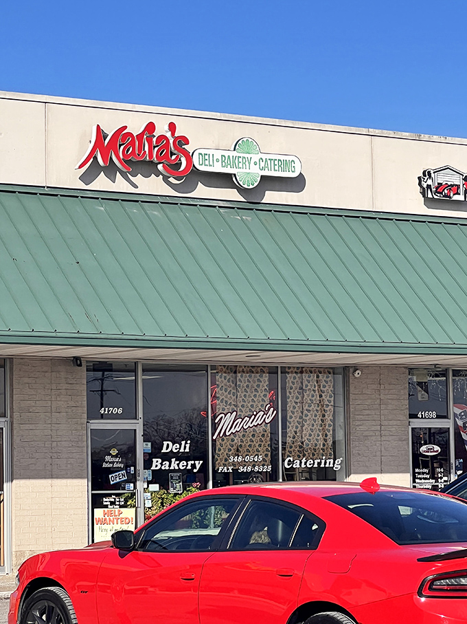 The unassuming exterior of Maria's Italian Bakery in Novi hides culinary treasures that would make any nonna proud. Green awning, red sign, pure magic inside.