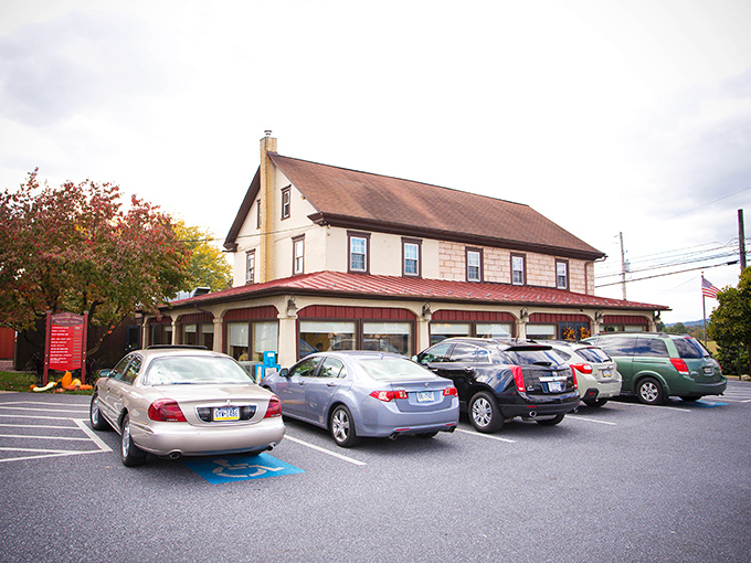 The Brickerville House stands proudly against the Pennsylvania sky, its flower boxes and American flags offering a warm welcome before you even reach the door.