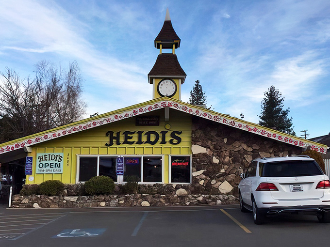 The Swiss chalet of breakfast dreams! Heidi's sunny yellow exterior with stone accents and charming clock tower promises Alpine comfort food that's worth the journey.