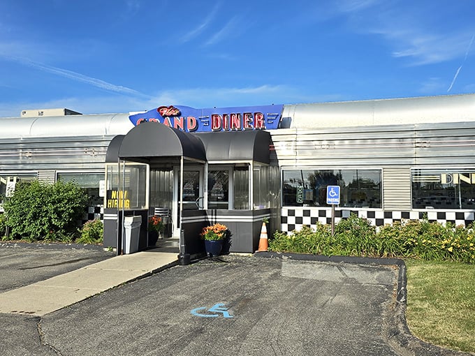 The silver exterior gleams like a time machine to the 1950s, with that iconic blue and red signage promising nostalgic delights within.
