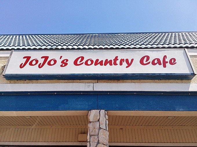 The blue roof beckons like a Florida sky, promising comfort beneath. JoJo's Country Cafe sits unassumingly in this Deltona strip mall, a hidden breakfast treasure waiting to be discovered.