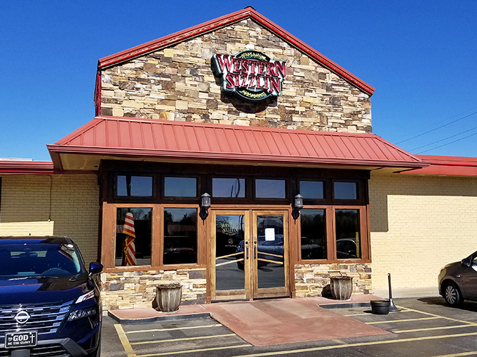 Stone facade meets red metal roofing in this unassuming temple to Southern comfort food excellence.