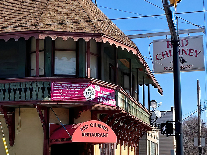 The iconic corner building with its distinctive red awning stands like a time capsule of comfort in Cleveland's Collinwood neighborhood.