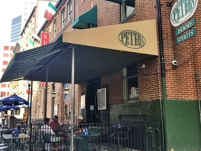 The unassuming brick exterior of Peter's Pour House beckons with its classic green awning and Irish flag&mdash;a culinary treasure hiding in plain sight.