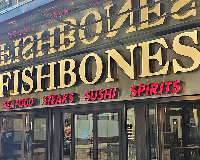 Fishbones announces itself with Vegas-worthy neon brilliance. The glowing sign promises seafood treasures within this Greektown hotspot.