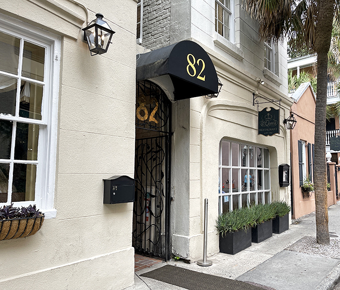 The unassuming cream exterior with its elegant black awning feels like stumbling upon a secret Charleston treasure. History whispers from every corner.