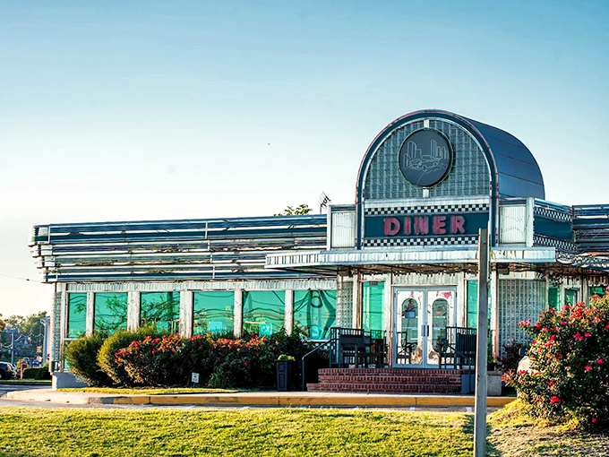 The classic curved facade with its bold "DINER" signage isn't just an entrance&mdash;it's a time machine to when comfort food reigned supreme.