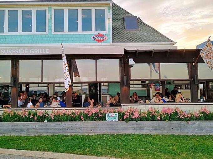 The aqua-colored exterior of Waterman's stands like a coastal beacon, promising seafood treasures within its unassuming beach house fa&ccedil;ade.