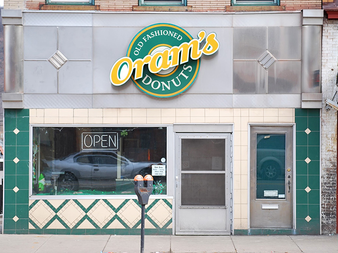 The iconic yellow and green Oram's sign beckons donut lovers like a sugary lighthouse in Beaver Falls. Old-fashioned indeed, but timeless in its appeal.