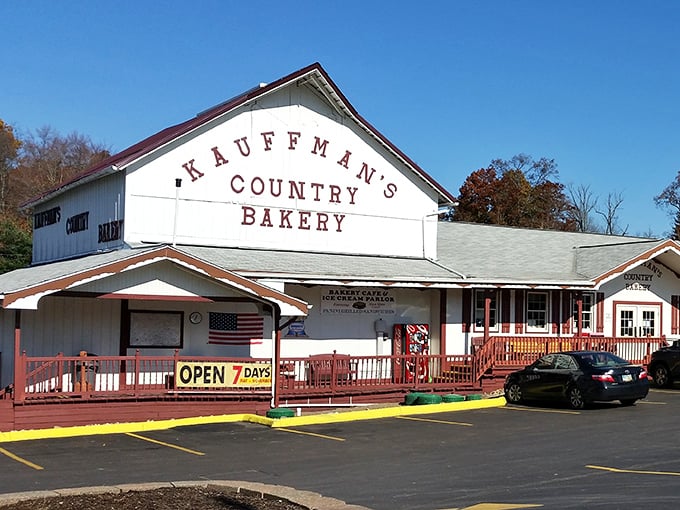 The iconic white facade with burgundy trim stands like a beacon of baked goodness. This isn't just a bakery&mdash;it's a destination worth the detour.