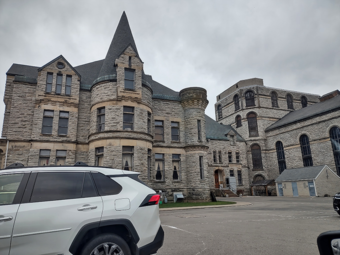 Gothic grandeur meets criminal history under moody Ohio skies. This imposing structure has intimidated visitors and inmates alike since the 1890s. 