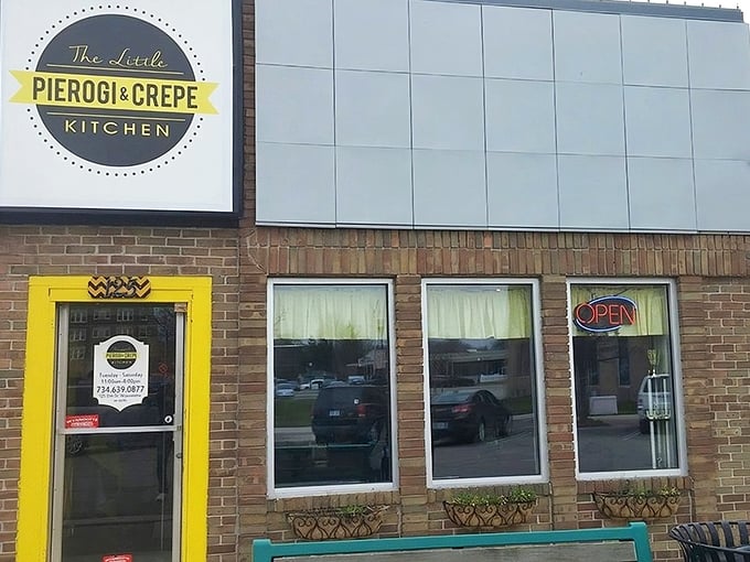 The bright yellow door beckons like a culinary lighthouse, promising Eastern European comfort and French finesse in downtown Wyandotte.