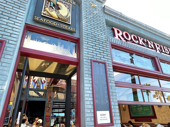The iconic blue exterior with bold red trim makes Rock'N Fish impossible to miss, like a maritime flag signaling "delicious food ahead" to hungry Manhattan Beach explorers.