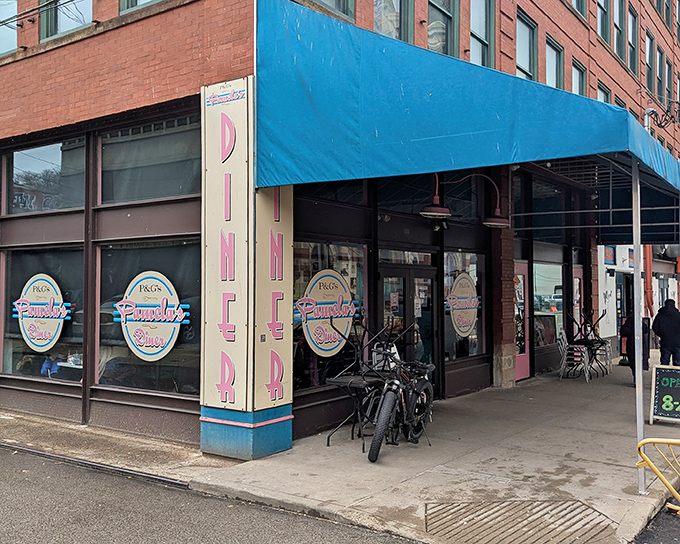 The iconic blue awning of Pamela's Diner in Pittsburgh's Strip District beckons breakfast enthusiasts like a beacon of hope for the hungry.