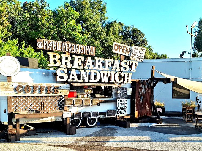 The holy grail of breakfast isn't hiding in some fancy hotel - it's right here in this rustic food stand with a sign that tells you exactly what you're getting.