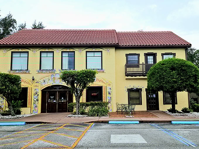 The sunshine-yellow facade of Yalaha Bakery stands like a cheerful postcard from Bavaria that somehow landed in Central Florida's lush landscape.