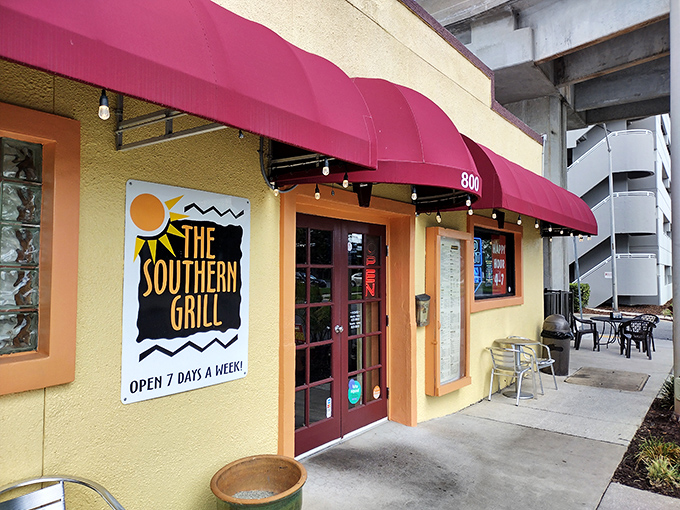 The unassuming yellow exterior with burgundy awnings stands like a culinary secret hiding in plain sight. Jacksonville's urban landscape provides the perfect backdrop for this neighborhood gem. 