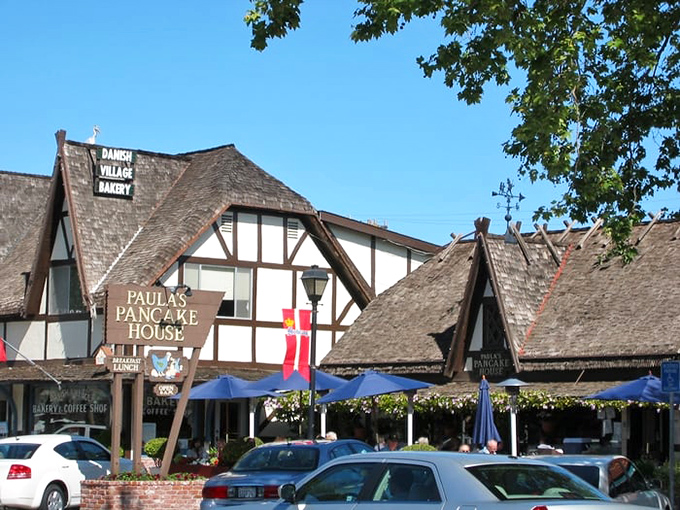 The iconic wooden sign beckons like a lighthouse for the breakfast-deprived. Paula's Danish-inspired architecture promises pancake nirvana in Solvang's storybook setting.
