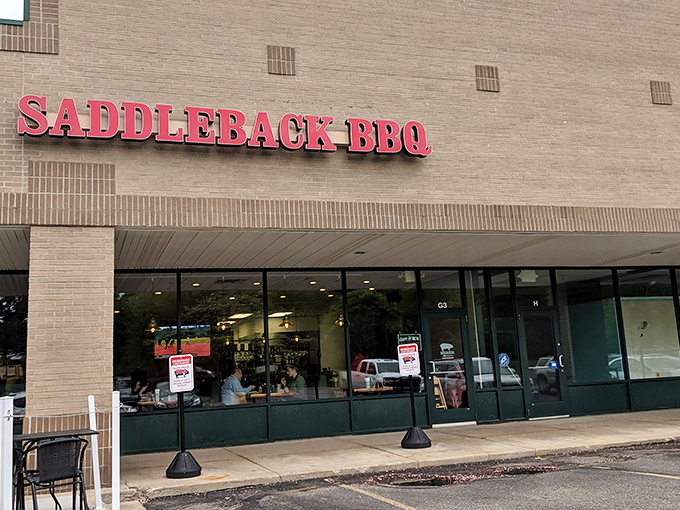 The bright red letters against beige brick promise smoky delights within. Like a barbecue beacon calling to hungry souls across Okemos.