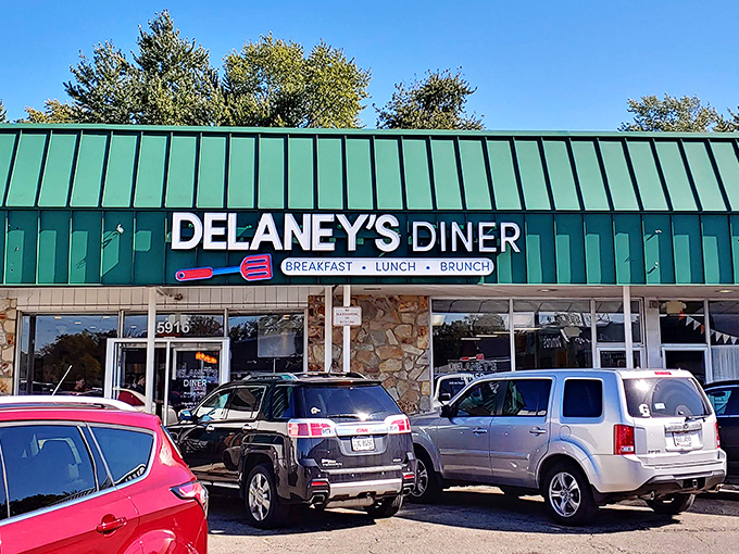 That teal roof isn't just eye-catching&mdash;it's a beacon for hungry souls. Delaney's stone facade promises comfort before you even step inside.