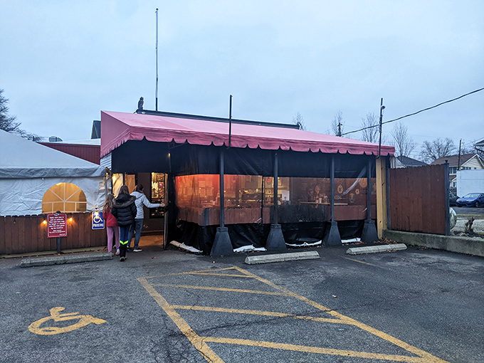 The red awning of DK Diner stands like a breakfast beacon in Grandview Heights, where morning warriors gather for their daily sustenance.