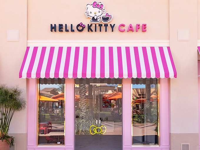 The pink palace beckons with its candy-striped awning – a portal to a world where adulthood takes a delightful vacation and your inner child gets VIP treatment.