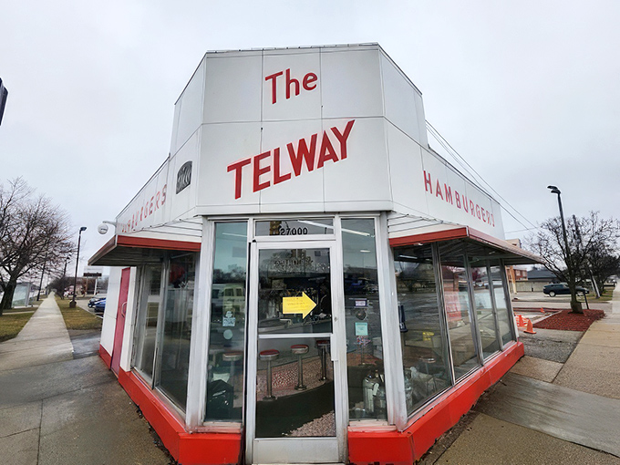 The iconic white and red exterior of Telway stands like a time capsule on Michigan Avenue, beckoning burger lovers with its retro charm and unmistakable presence.