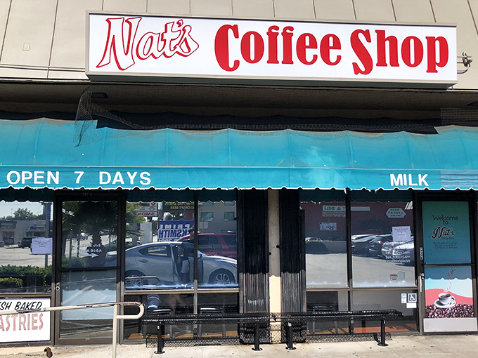 The unassuming storefront of Nat's Early Bite beckons from its strip mall perch, promising comfort food treasures within those teal-trimmed walls.