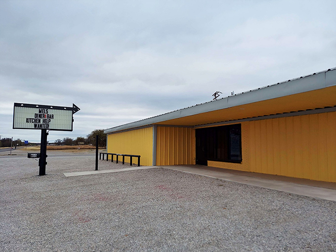 The bright yellow exterior of Mel's Diner stands like a beacon of hope for hungry travelers on the Texas highway. That classic sign promises comfort food salvation ahead.