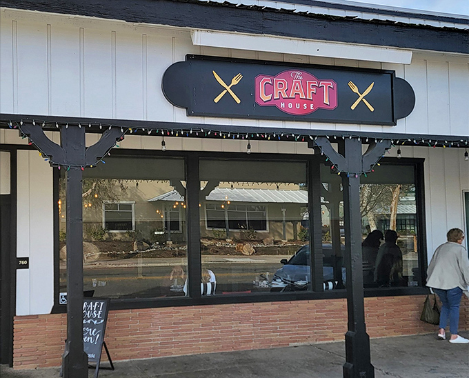 The Craft House's charming exterior beckons with its classic white siding and distinctive black signage&mdash;like a culinary lighthouse guiding hungry travelers home.