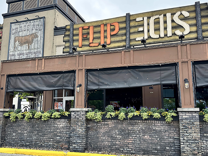 The rustic-industrial facade of Flip Side beckons hungry travelers with its bold signage and inviting brick patio&mdash;a carnivore's lighthouse in Easton's retail sea.