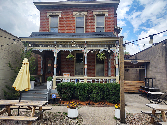 Victorian charm meets barbecue brilliance at this red brick beauty. String lights and picnic tables create the perfect setting for meat-fueled memories.